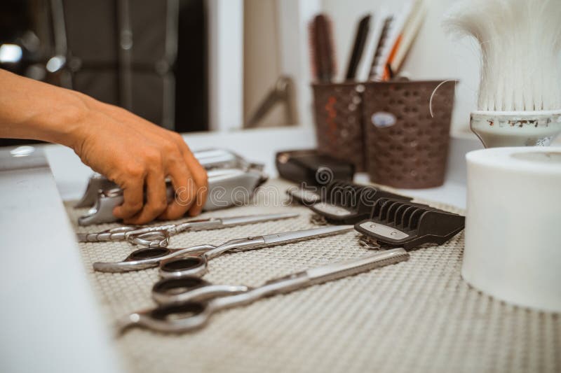 Barber Hand Picking an Haircut Instrument from Table Stock Image ...