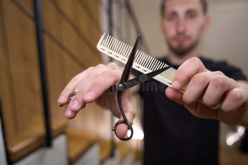 Barber Man Holding Scissors and Comb in Hands Stock Image - Image of ...