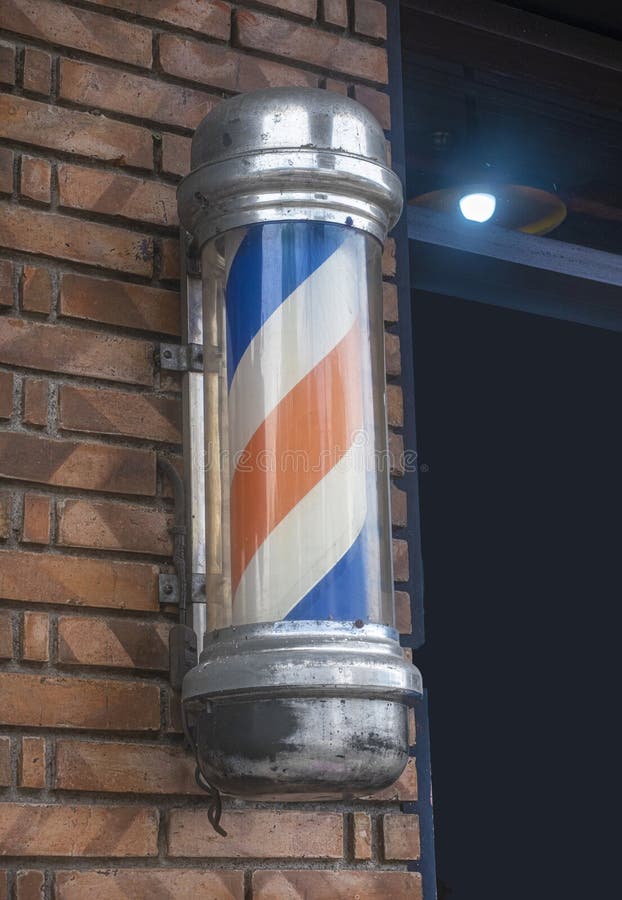Barber S Pole on Brick Wall with Glowing Lamp Stock Image - Image of ...