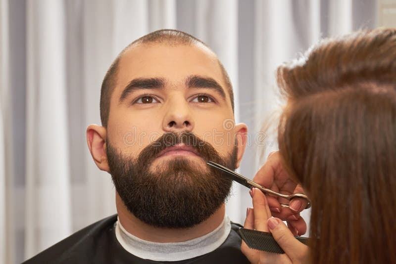 Barber with Scissors Trimming Beard. Stock Image - Image of male ...