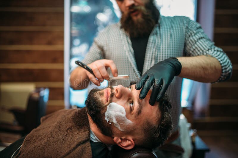 Barber Combing Beard of Client Man in Salon Cape Stock Image - Image of ...