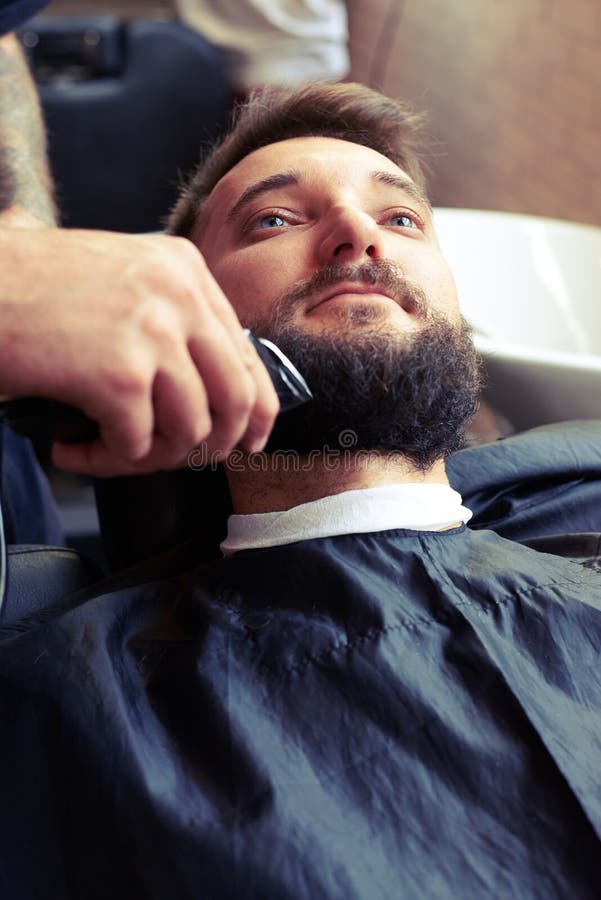 Barber Shaving Beard with Electric Razor Stock Photo - Image of ...