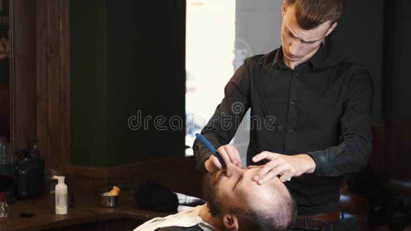 Barber Shaving Man with a Classic Razor Stock Footage - Video of ...