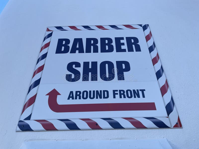 A Barber Shop Sign Red White and Blue Around Front on a Wall Stock ...