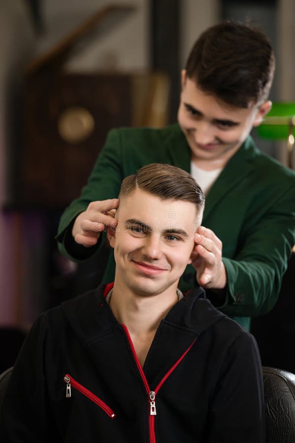 Barber Shows the Final Result of the Haircut To the Client Stock Image ...