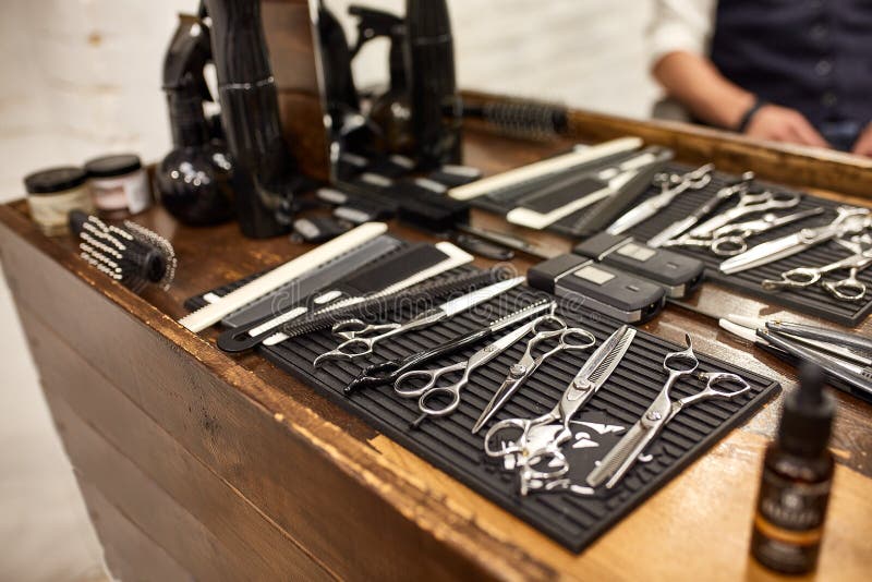 Barber Tools on Wooden Shelf and Mirror in Barbershop Stock Photo ...