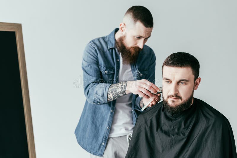 Barber Trimming Clients Hair in Barbershop Stock Photo - Image of ...