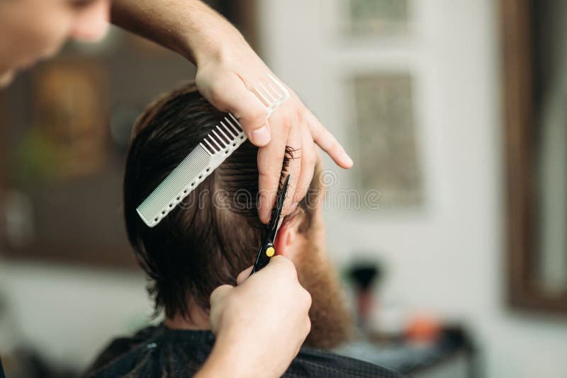 Barber Using Scissors and Comb in Barbershop Stock Image - Image of ...