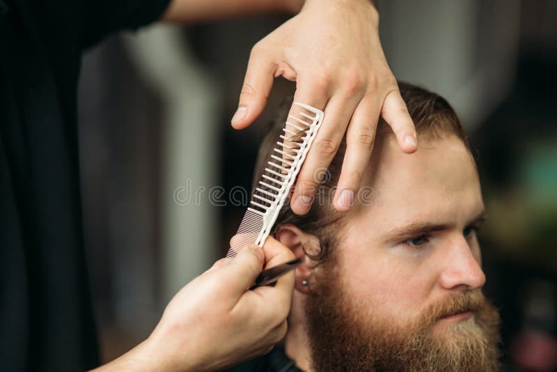 Barber Using Scissors and Comb in Barbershop Stock Image - Image of ...