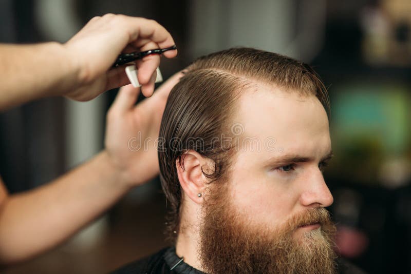 Barber Using Scissors and Comb in Barbershop Stock Image - Image of ...