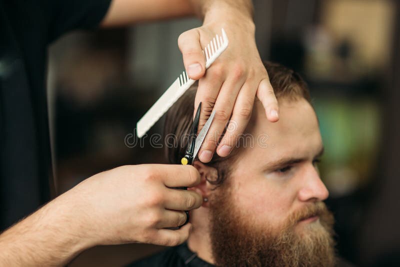 Barber Using Scissors and Comb in Barbershop Stock Image - Image of ...