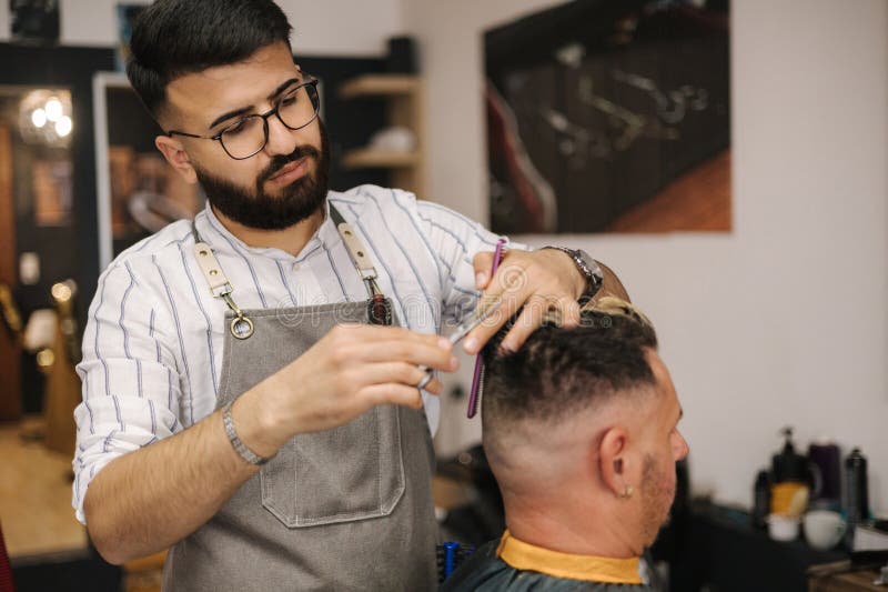 Side View of Barber Using Scissors and Making Hairstyle. Modern ...