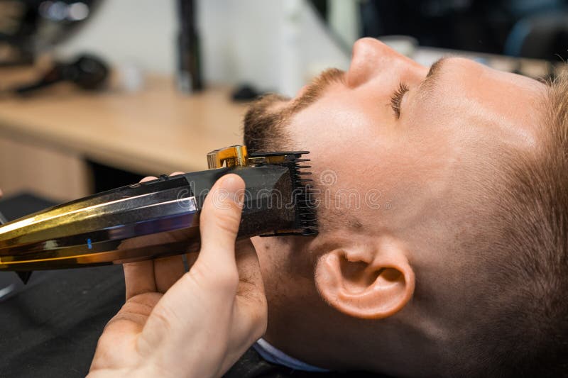 Barbers Skilled Hand Deftly Trims a Clients Beard Using a Precision ...