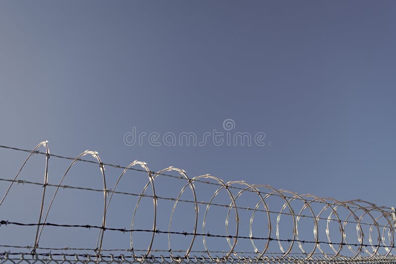 Barbwire Prison Wall with Barbed Wire Fence Coiled Razor Wire Perimeter ...