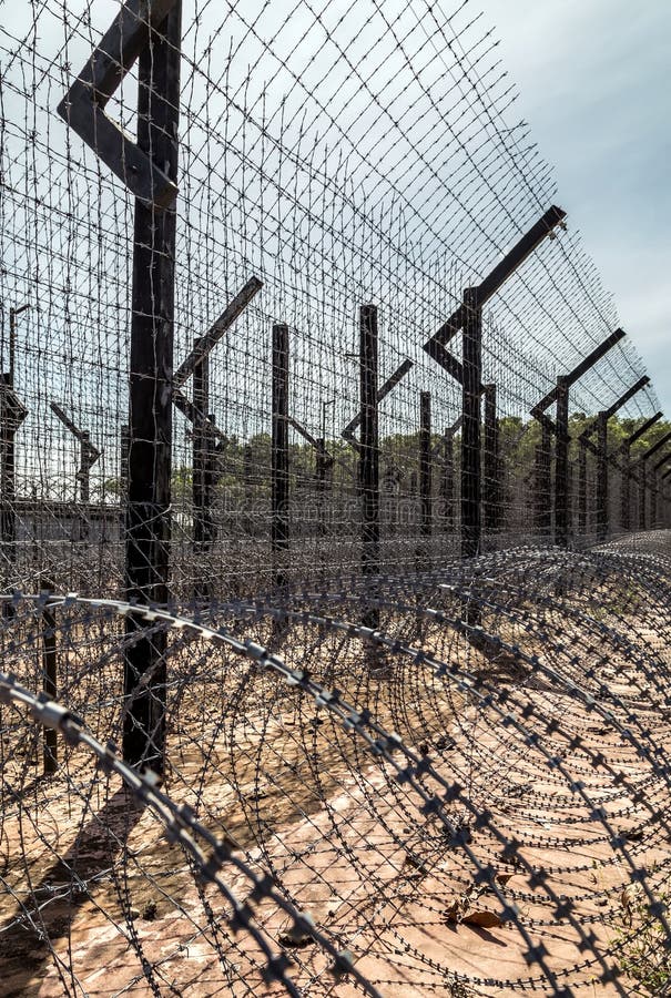 Barbwire Secure Border of the Prison. Fence with Metal Barb ...