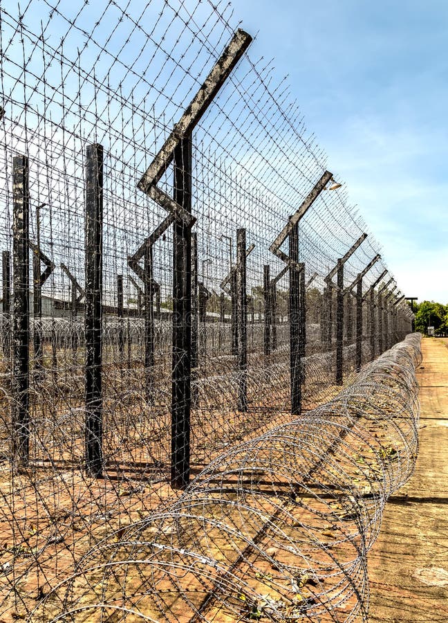 Barbwire Secure Border of the Prison. Fence with Metal Barb ...