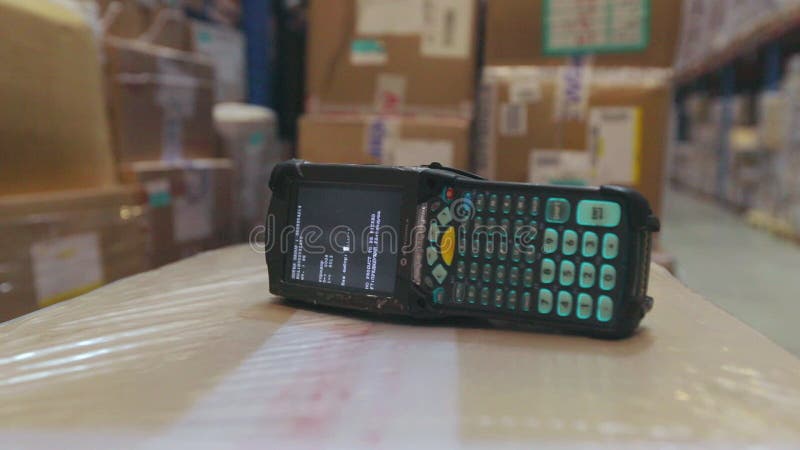 Barcode Scanner Close-up. Barcode Scanner Lies on a Cardboard Box Stock ...