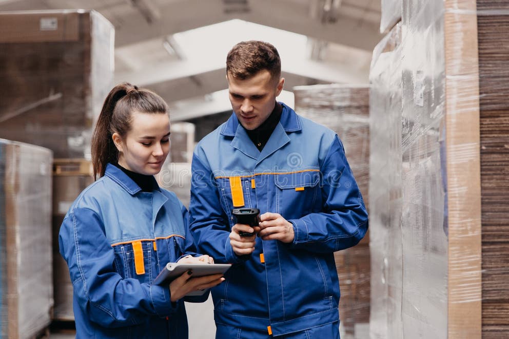 Barcode Scanner in Front of Modern Warehouse and Scanning Code on ...