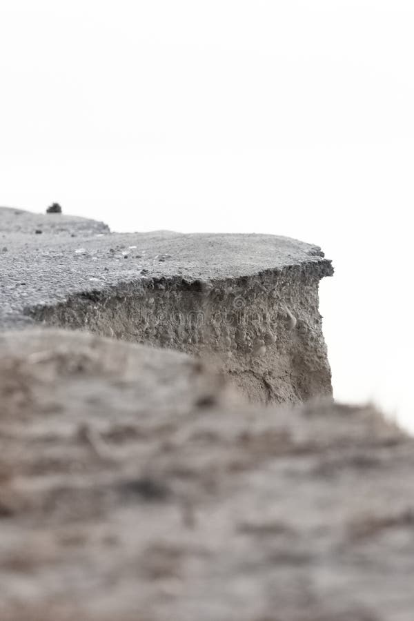 Bare Edge of Sandy Stone Cliff Over Ocean Stock Photo - Image of ...