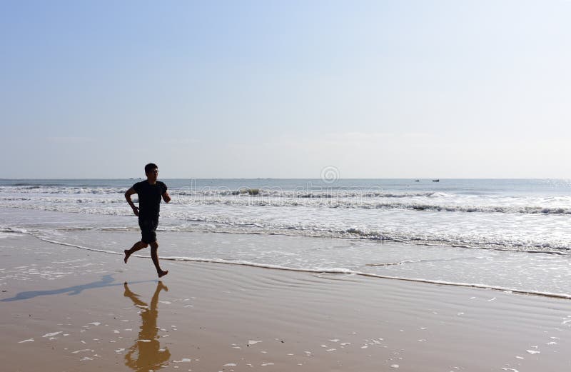 Bare Feet Man Running on Beach with Waves Stock Image - Image of ...