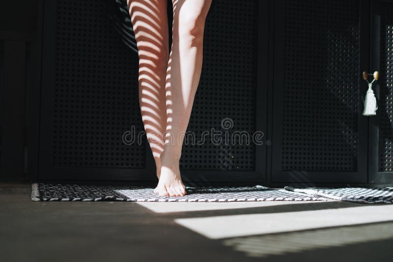Bare Feet of Young Woman in the Bathroom at Home, Light and Shadow ...