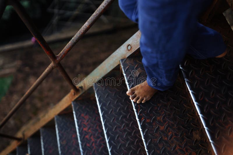 Barefoot on the Metal Ladder Comes Down a Child Stock Image - Image of ...