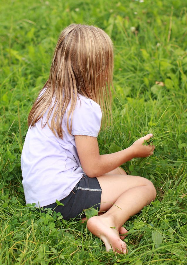Barefoot girl on grass stock image. Image of sitting - 26092441