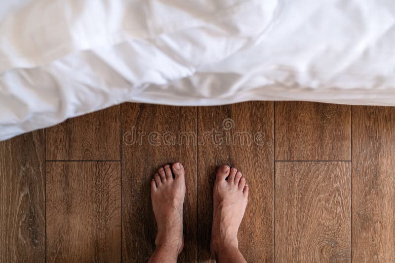 Barefoot Male Standing in Front of the Bed Stock Photo - Image of ...