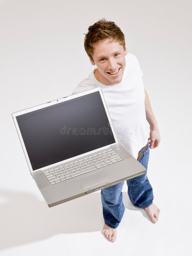 Barefoot Man Holding Laptop Stock Photo - Image of young, shoeless: 6601712