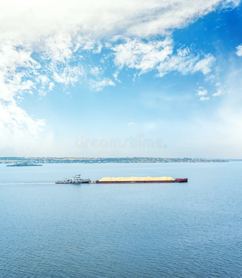 Barge Loaded with Sand on the River. Blue Sky with Clouds Over Big ...
