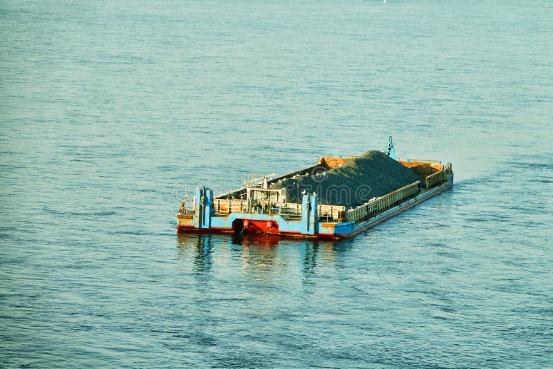 A Barge with Rubble is Anchored Stock Photo - Image of coastwise ...