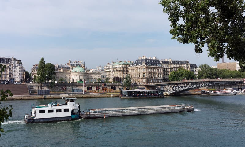 Barge on Seine river editorial stock image. Image of footbridge - 50250874