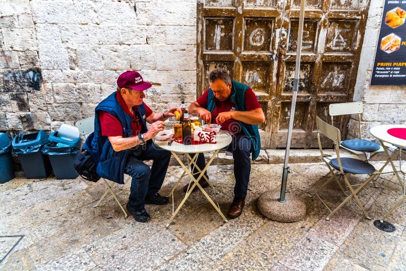 Bari, Italy - March 10, 2019: Italian Workers Having Lunch while ...