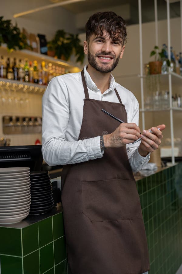 Barista with Beard Standing in Bar Counter and Using Organizer for ...