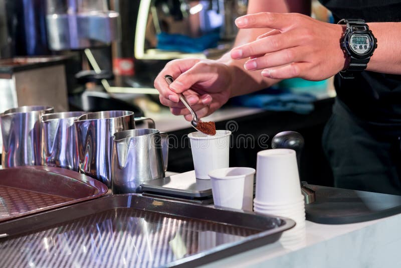 Barista Checking Fine Ground Coffee To Optimize the Grinder Stock Photo ...