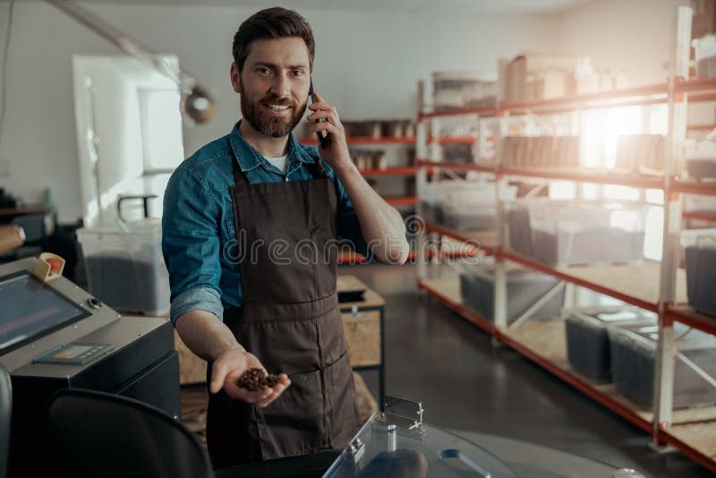 Barista on Coffee Factory Talking Phone on Background of Coffee ...