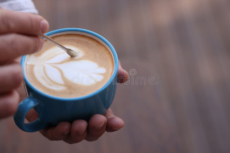 Barista Creating Pattern in Cup of Coffee on Blurred Background ...