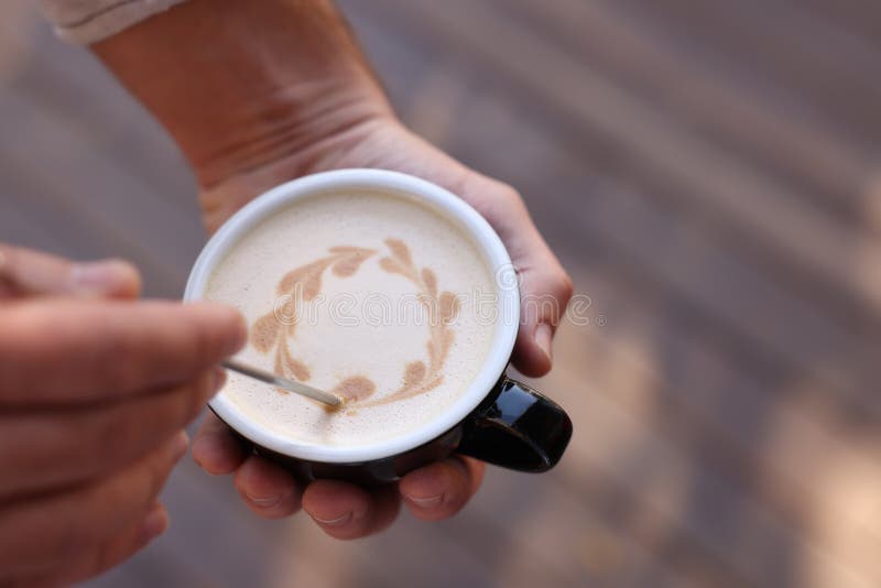 Barista Creating Pattern in Cup of Coffee on Blurred Background ...
