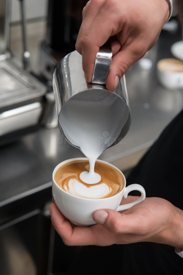 Barista doing your coffee stock photo. Image of industrial - 43545368
