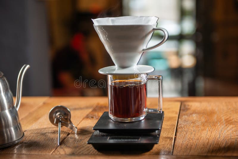 Barista Expertly Using a Drip Coffee Maker To Create a Flavorful Cup of ...