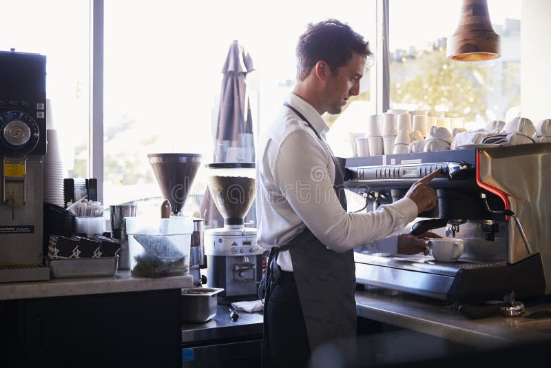 Barista Making Coffee in Delicatessen Using Machine Stock Image - Image ...