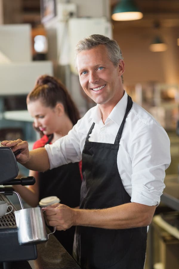 A Barista is Making Coffee in a Coffee Shop Stock Photo - Image of ...