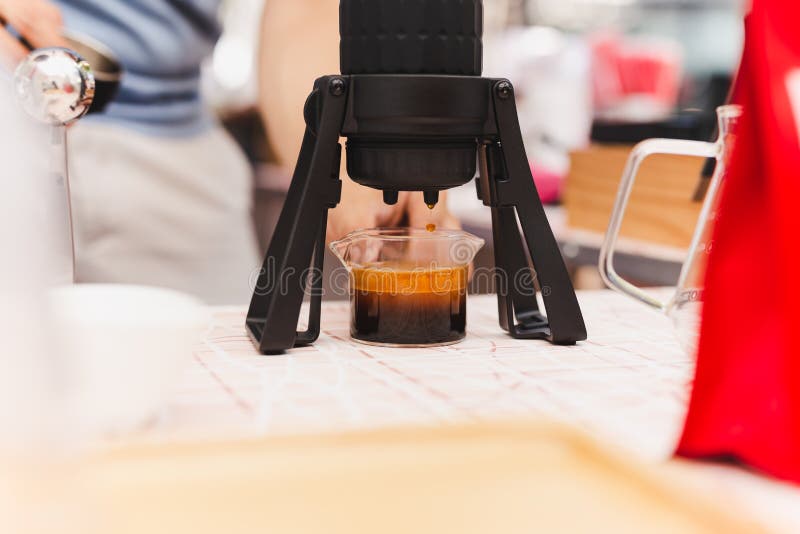 Barista Making Espresso Coffee Using Aeropress in Cafe. Stock Image ...