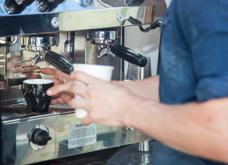 A Barista is Making Coffee in a Coffee Shop Stock Photo - Image of ...