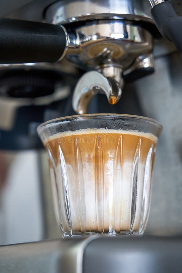 A Barista is Making a Latte with an Espresso Machine Stock Image ...