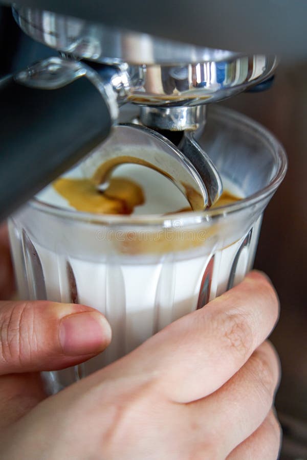 A Barista is Making a Latte with an Espresso Machine Stock Image ...