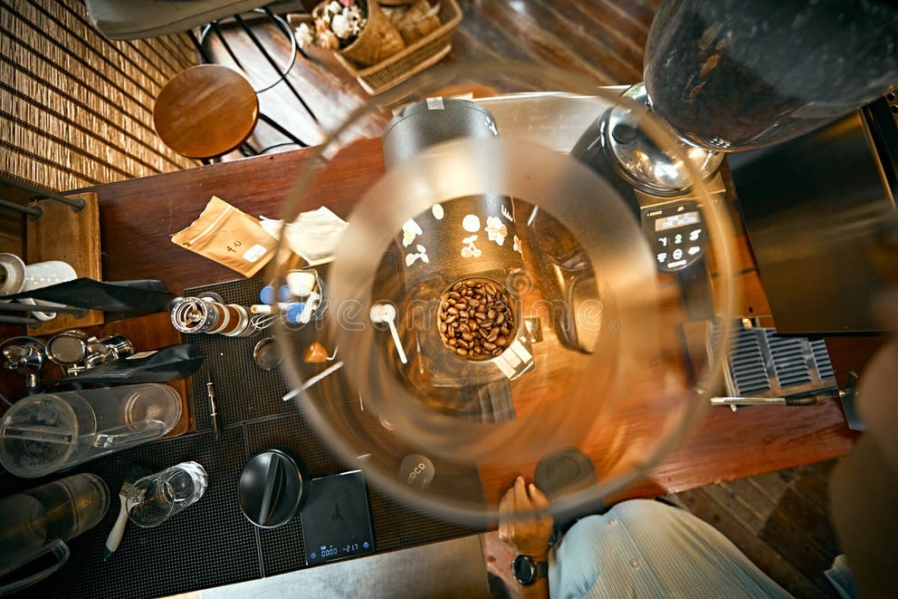 Barista operating grinder stock image. Image of appliance - 326111637