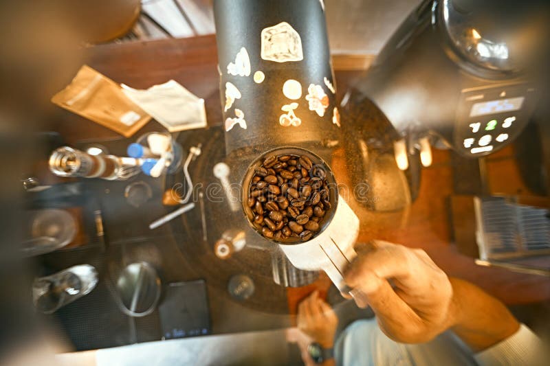 Barista operating grinder stock photo. Image of barista - 326111646