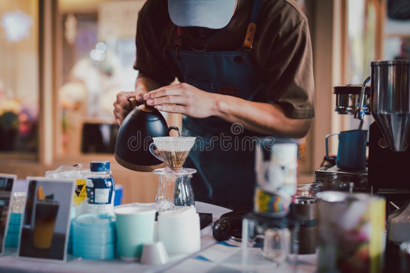Barista Pouring Hot Water To Make Drip Coffee. Stock Image - Image of ...