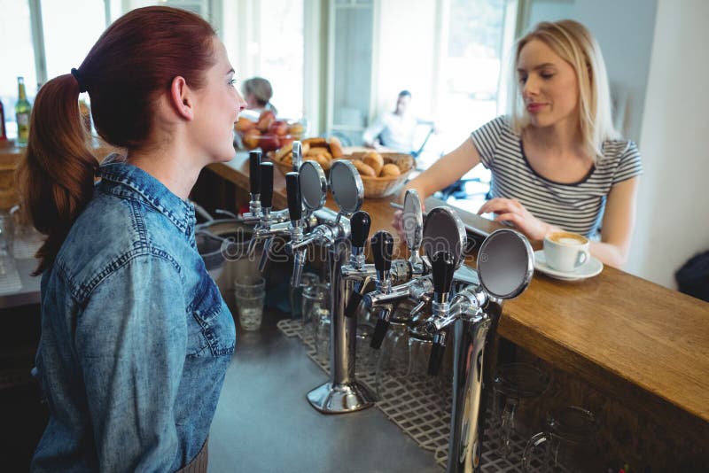 Barista Talking with Customer at Cafe Stock Photo - Image of indoors ...